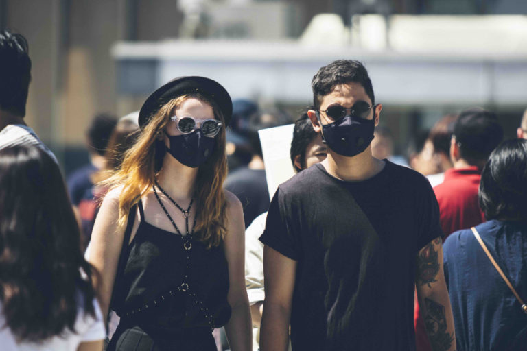 2 People Wearing Airinum Masks in crowd copy - Global Wellness Summit